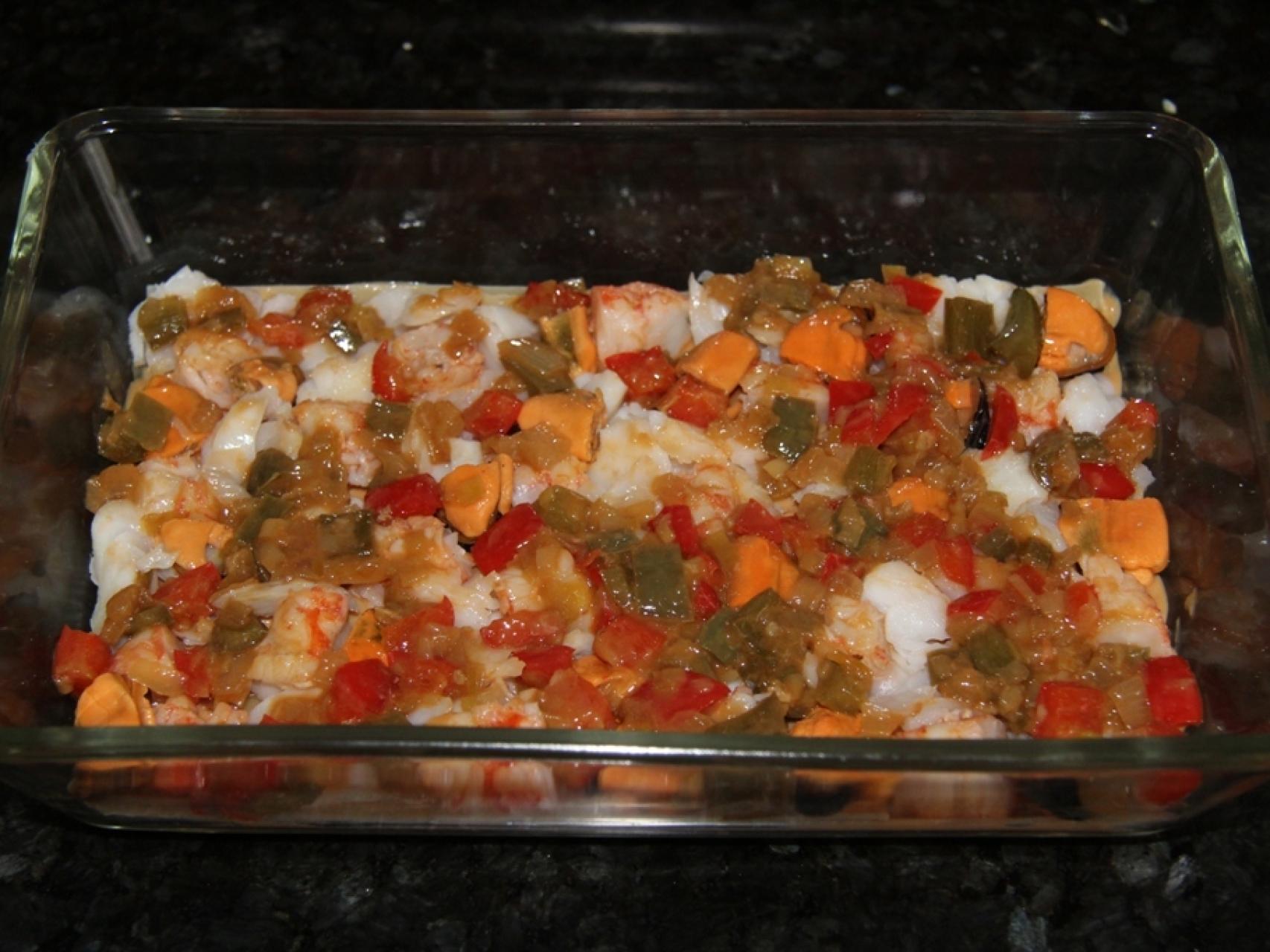 Lasaña de merluza con mejillones y gambones